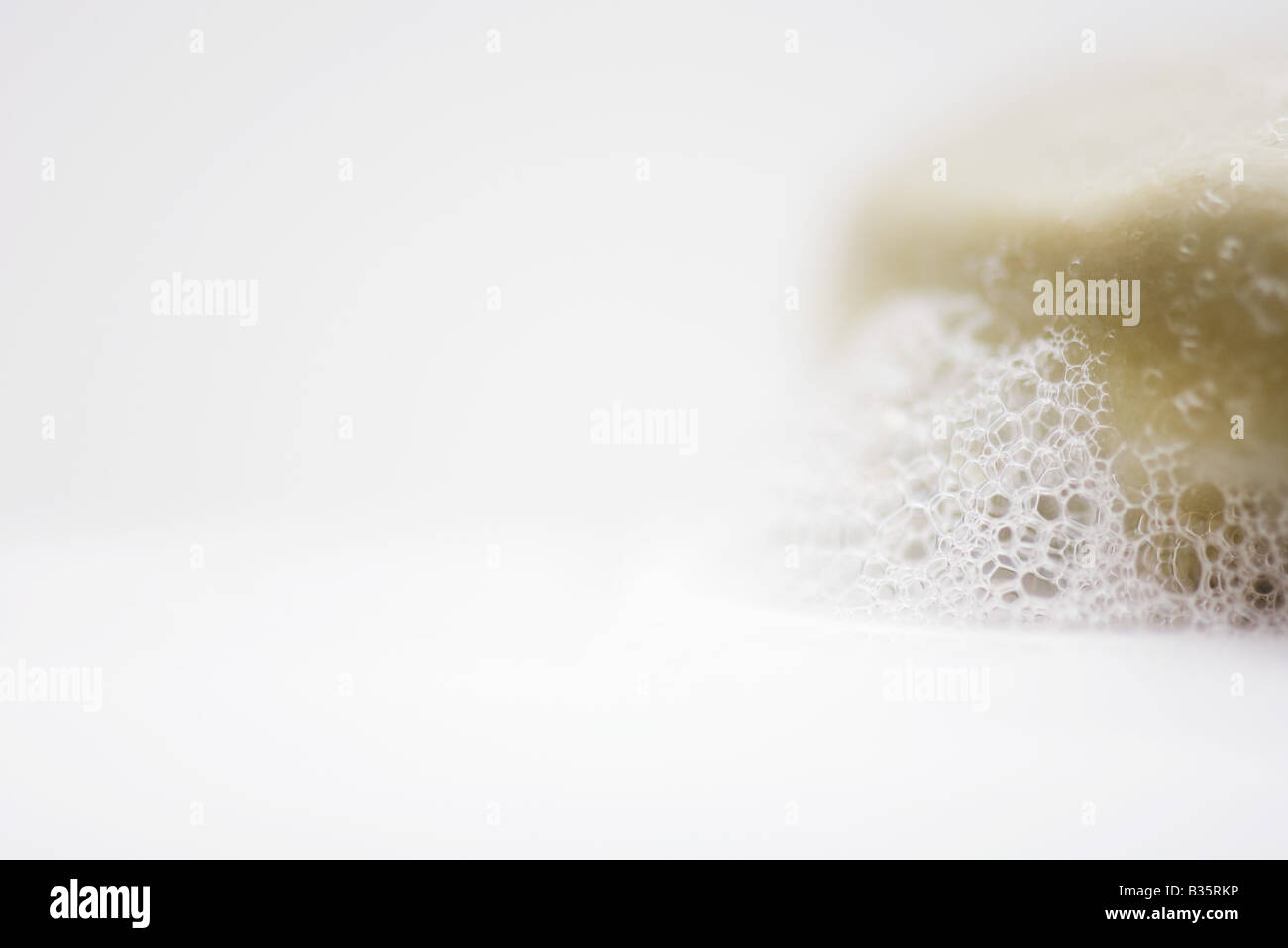 Bar of soap and suds, close-up Stock Photo - Alamy