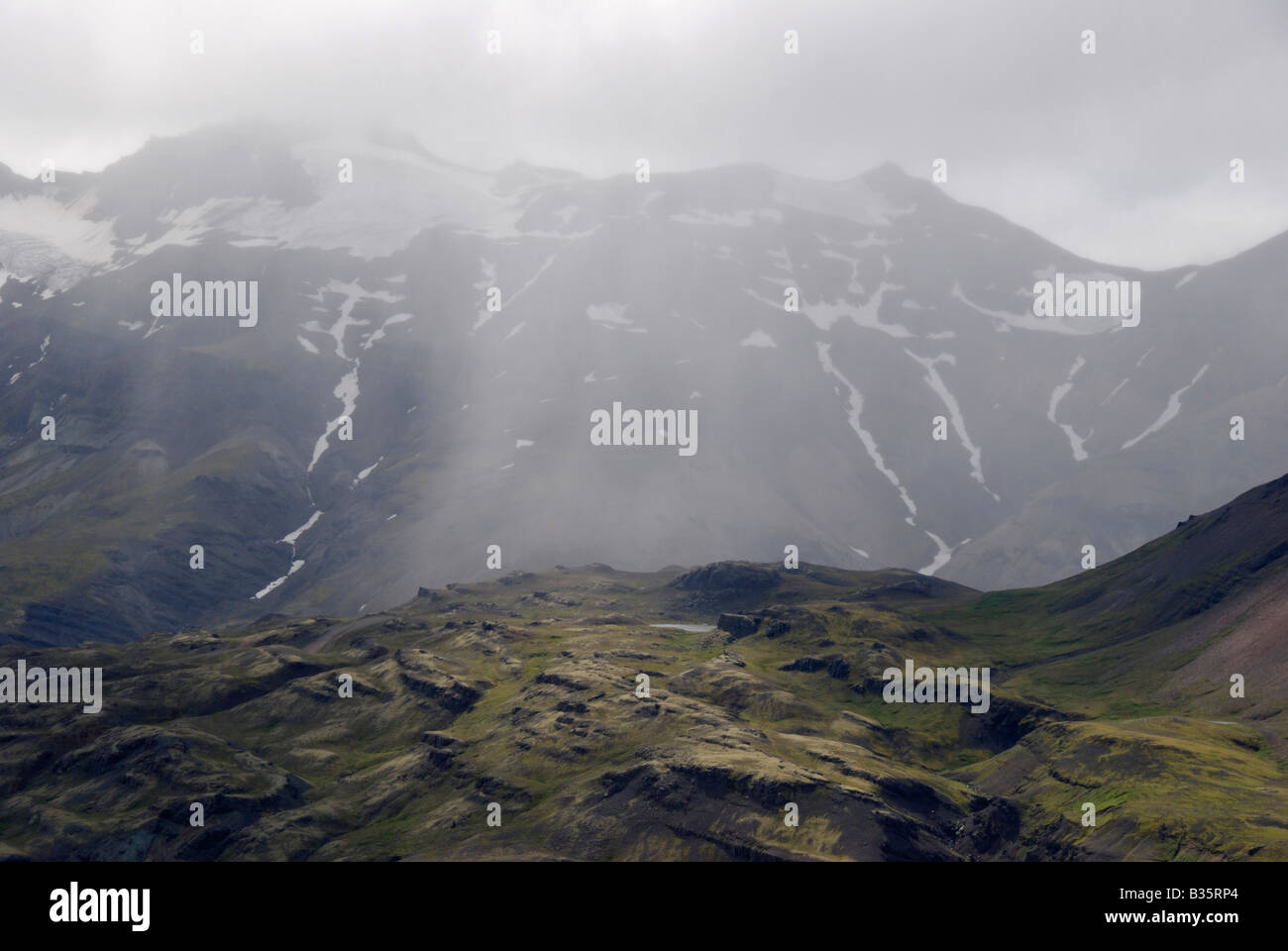 Rain shower over mountains near Múlaskáli Lónsöraefi Iceland Stock ...