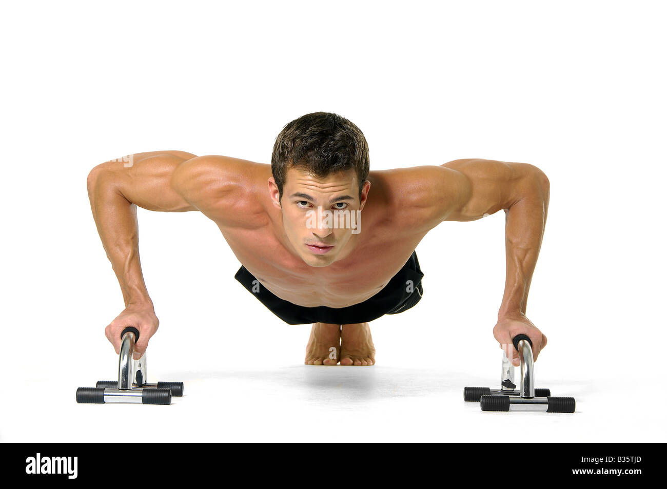 Portrait of a young man doing push-ups Stock Photo - Alamy