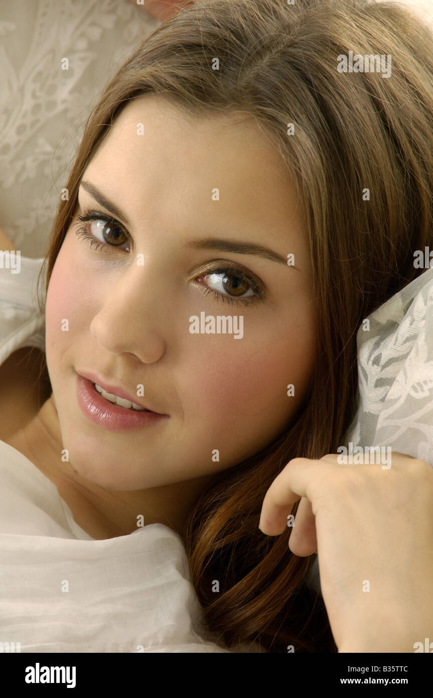 Portrait of a young woman grinning Stock Photo - Alamy