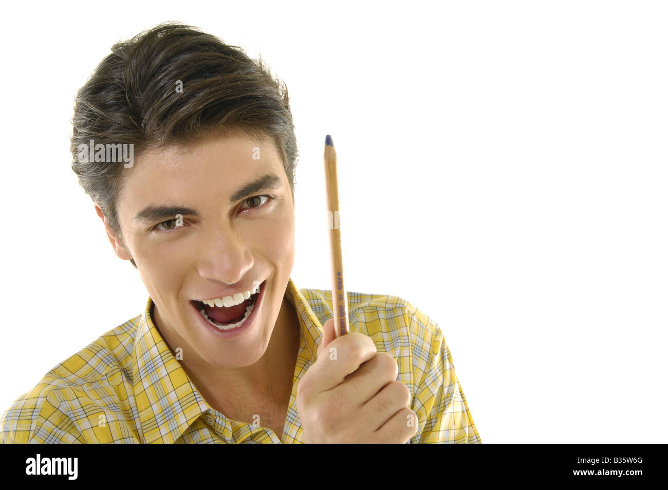 Portrait of a young man holding a pencil and laughing Stock Photo - Alamy