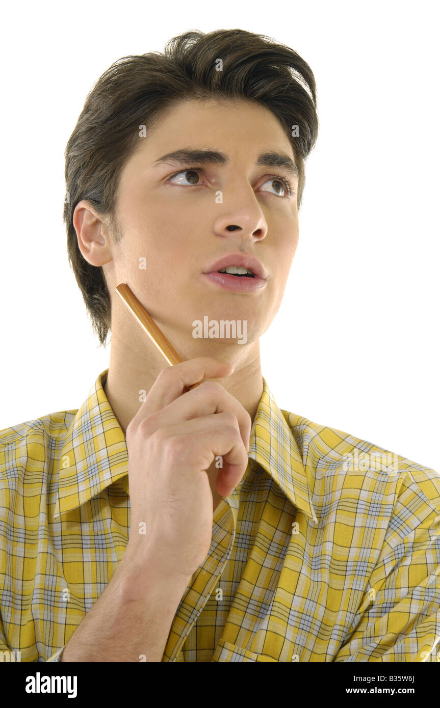 Close-up of a young man holding a pencil and thinking Stock Photo - Alamy
