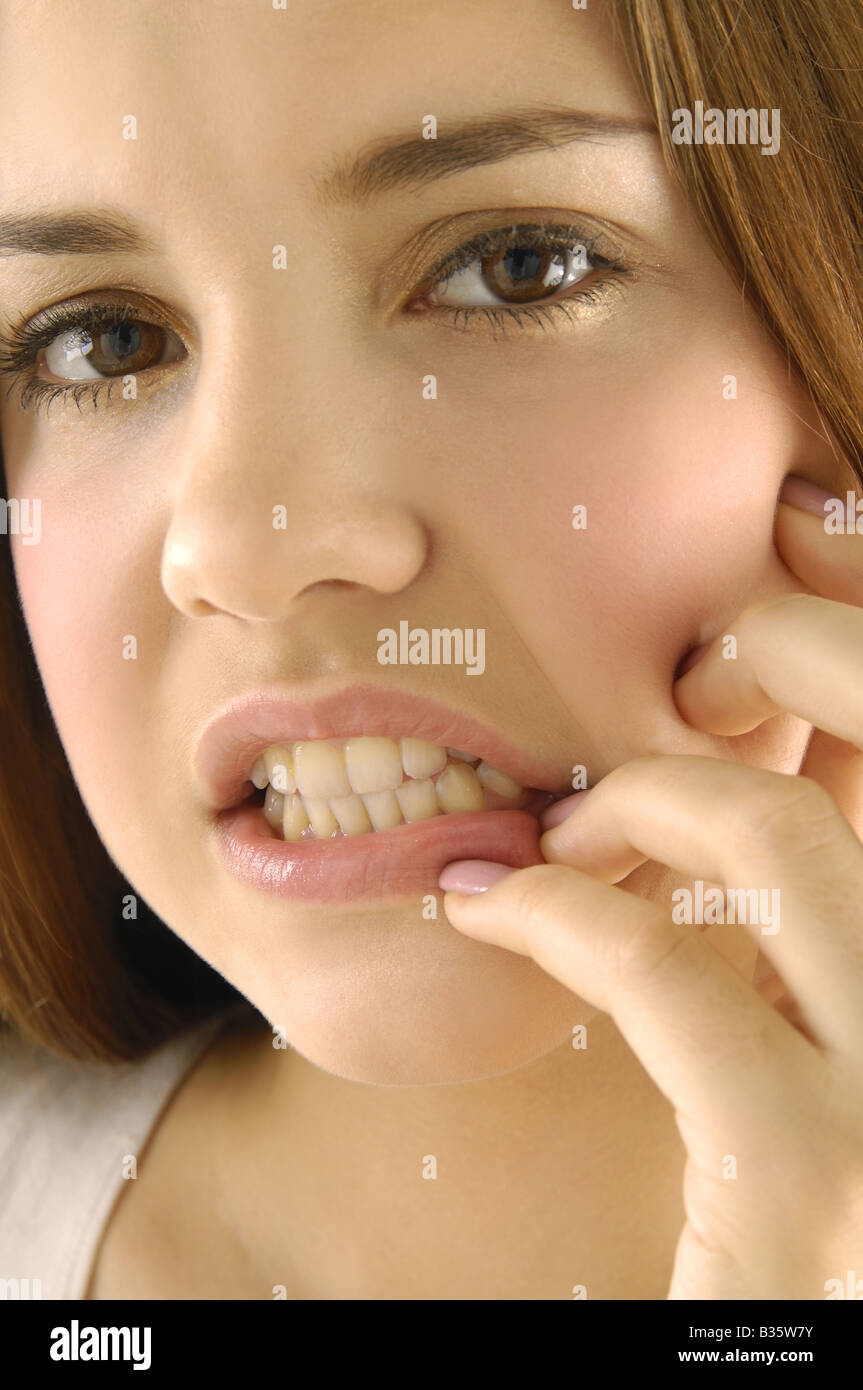 Portrait of a young woman pressing cheek to calm toothache Stock Photo ...