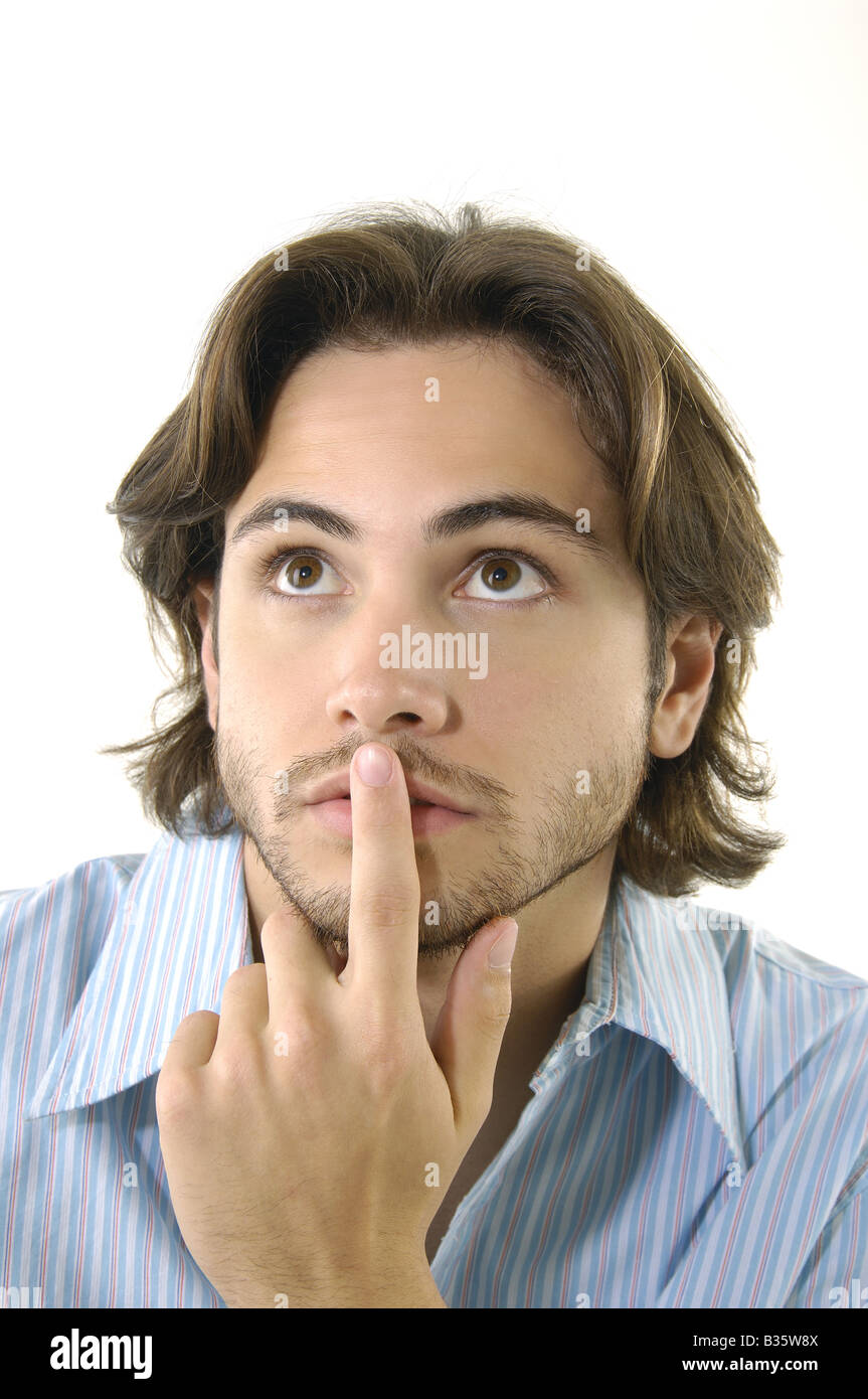 Close-up of a young man thinking Stock Photo - Alamy