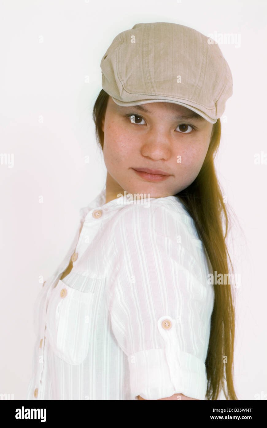 Young Asian woman wearing cap portrait Stock Photo - Alamy