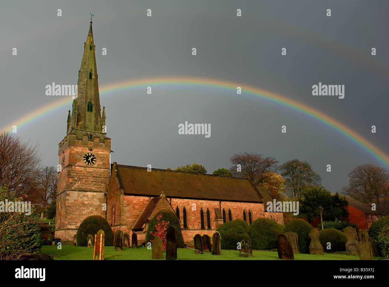 St Benedict Biscop church and rainbow Wombourne Staffordshire Stock ...