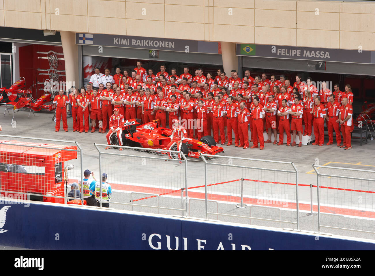 Kimi Raikkonen, Felipe Massa and the Ferrari team pose for group photo ...