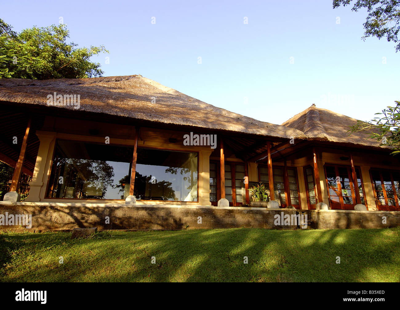 View of a building covered with thatch Stock Photo - Alamy