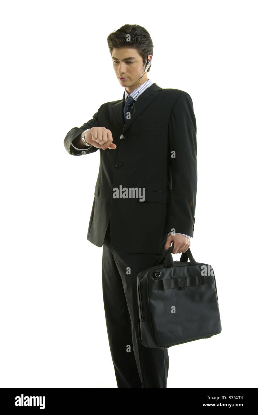 Businessman checking the time in his wristwatch Stock Photo - Alamy
