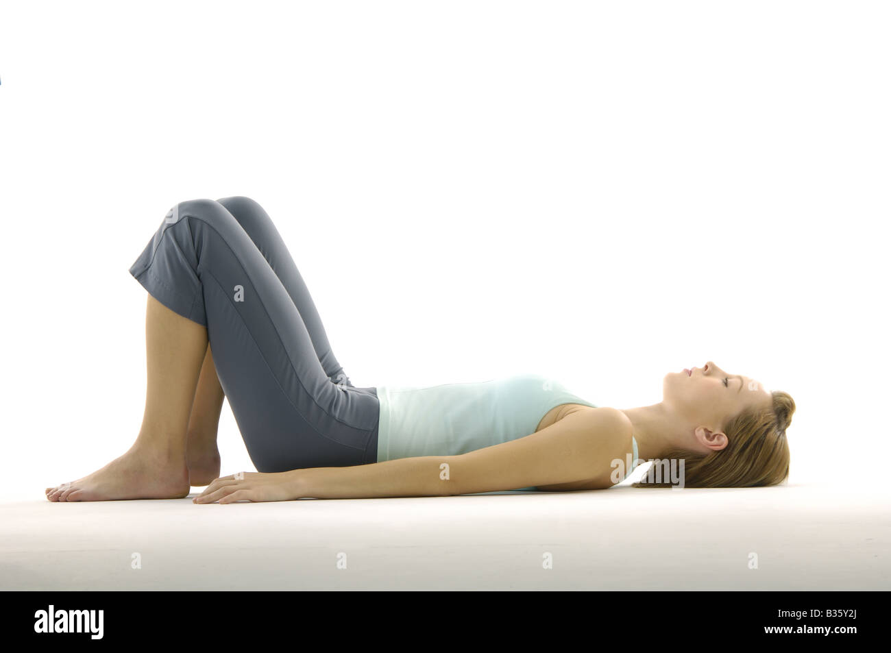 Side profile of a young woman exercising Stock Photo - Alamy