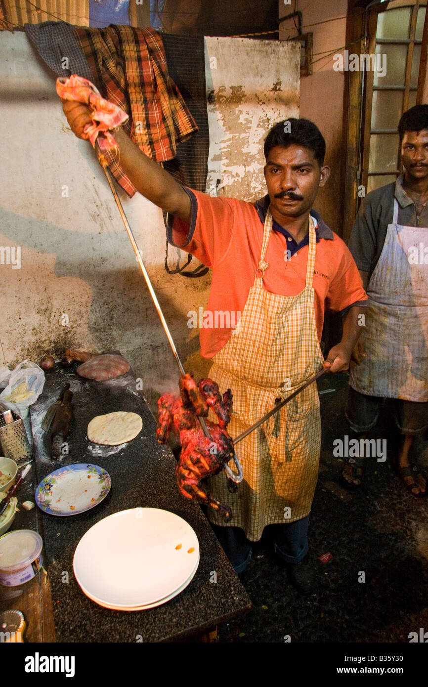 A tandoor kitchen in Kochi, India. The chef has been preparing tandoori ...
