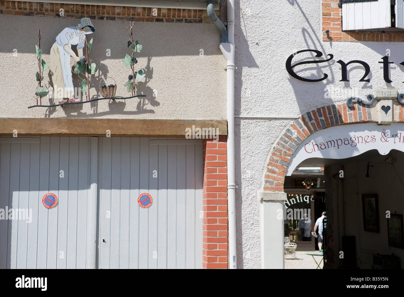 Grape harvester sign above garage door house hi-res stock photography ...