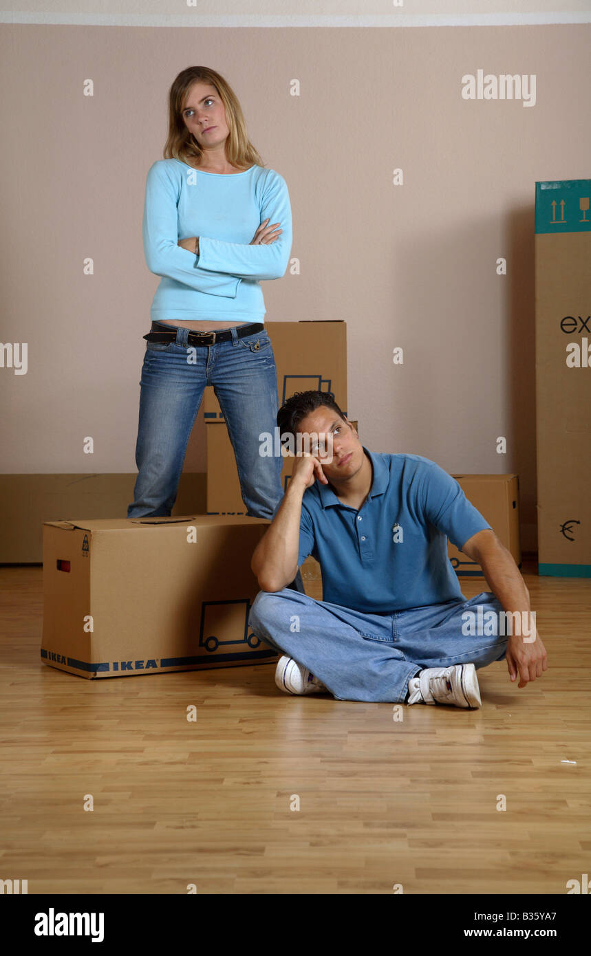 Young couple fighting while moving in Stock Photo - Alamy