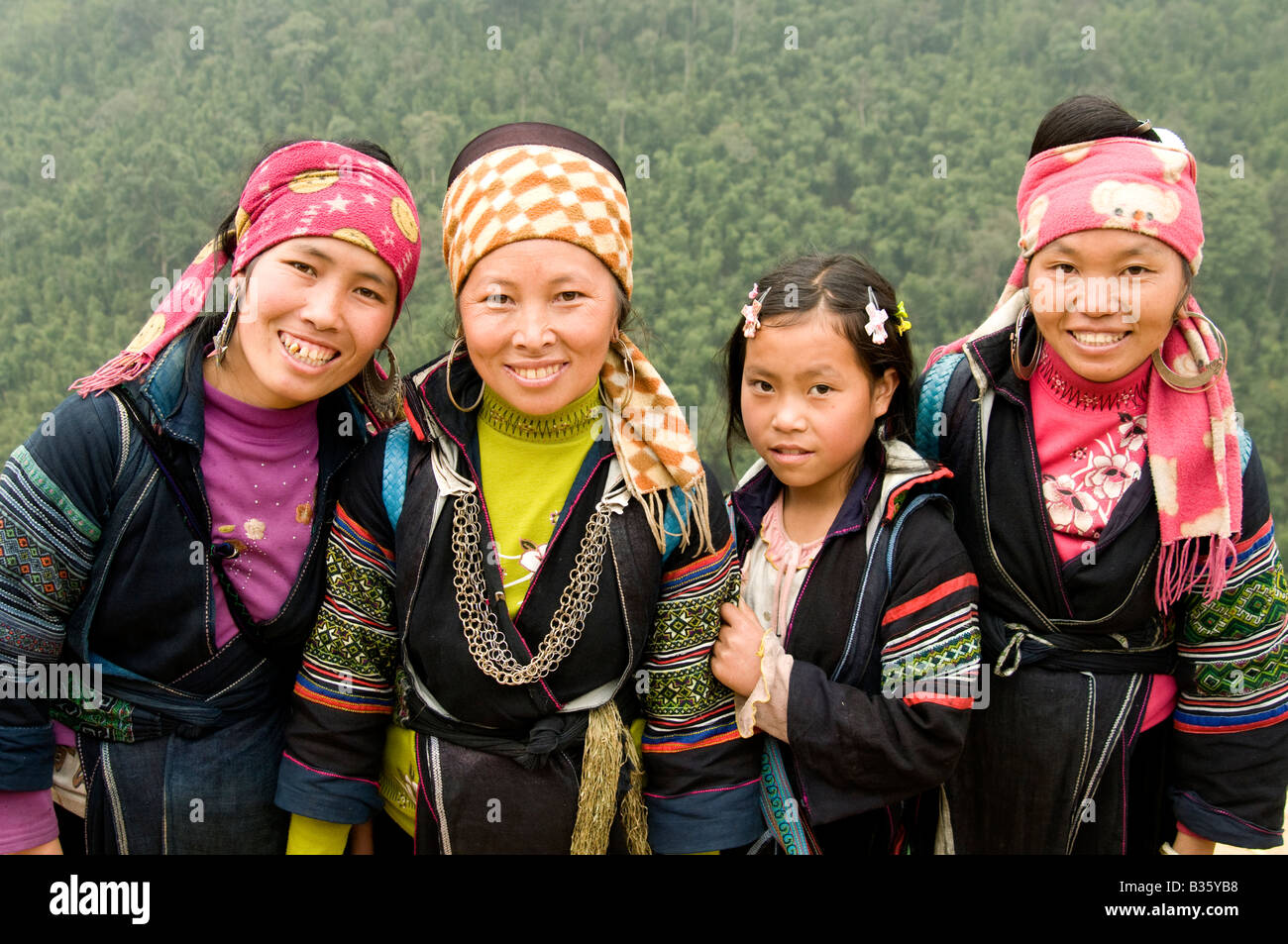 Four smiling Black Hmong woman in the hills around Sapa North Vietnam ...