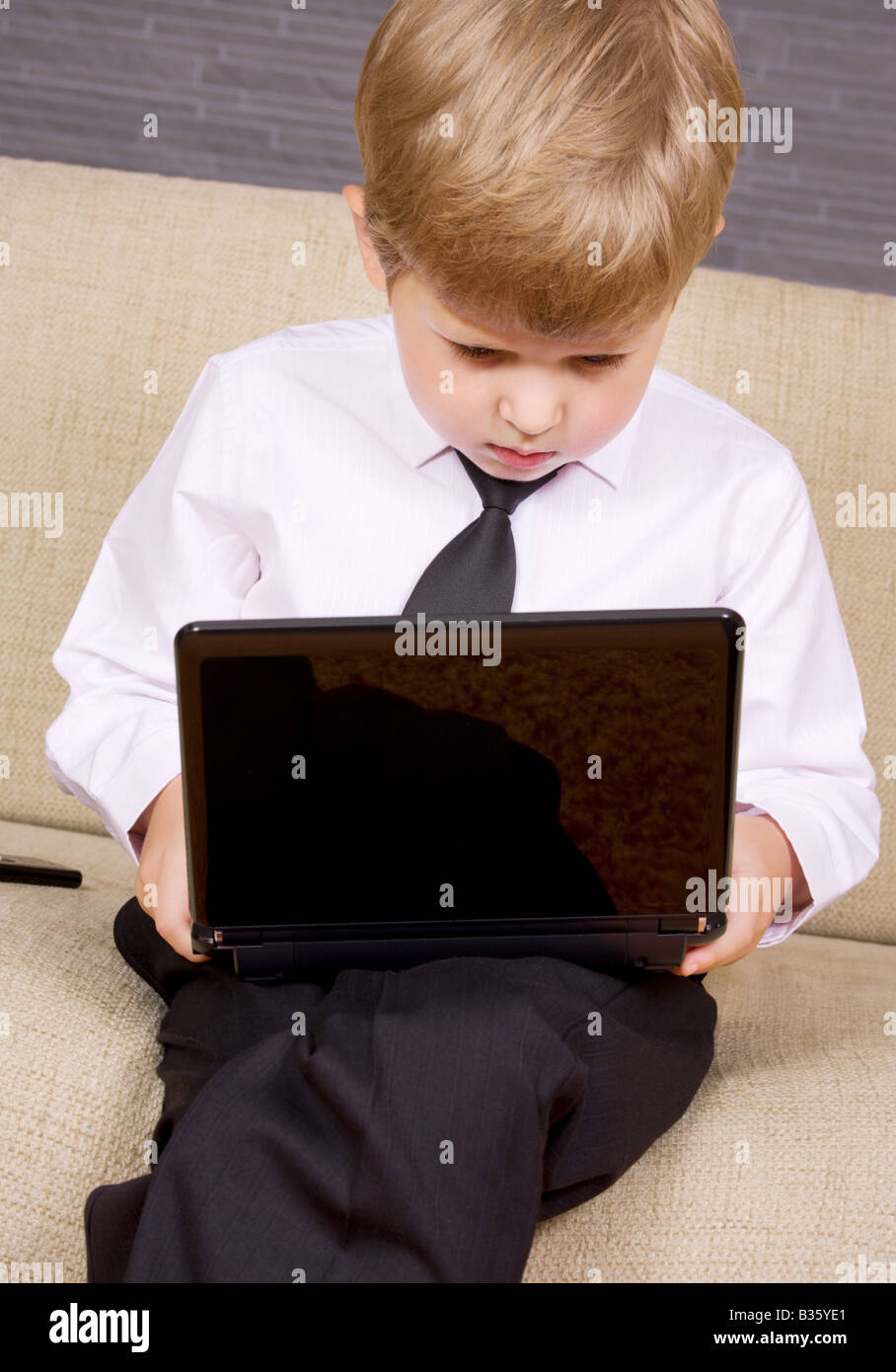picture of boy with black laptop computer Stock Photo - Alamy
