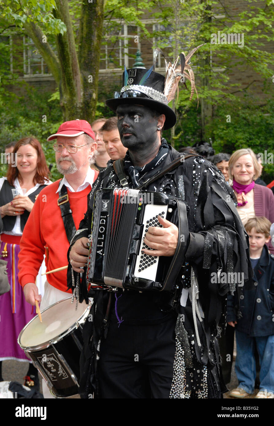 Traditional musician playing the accordion in the open air for English ...