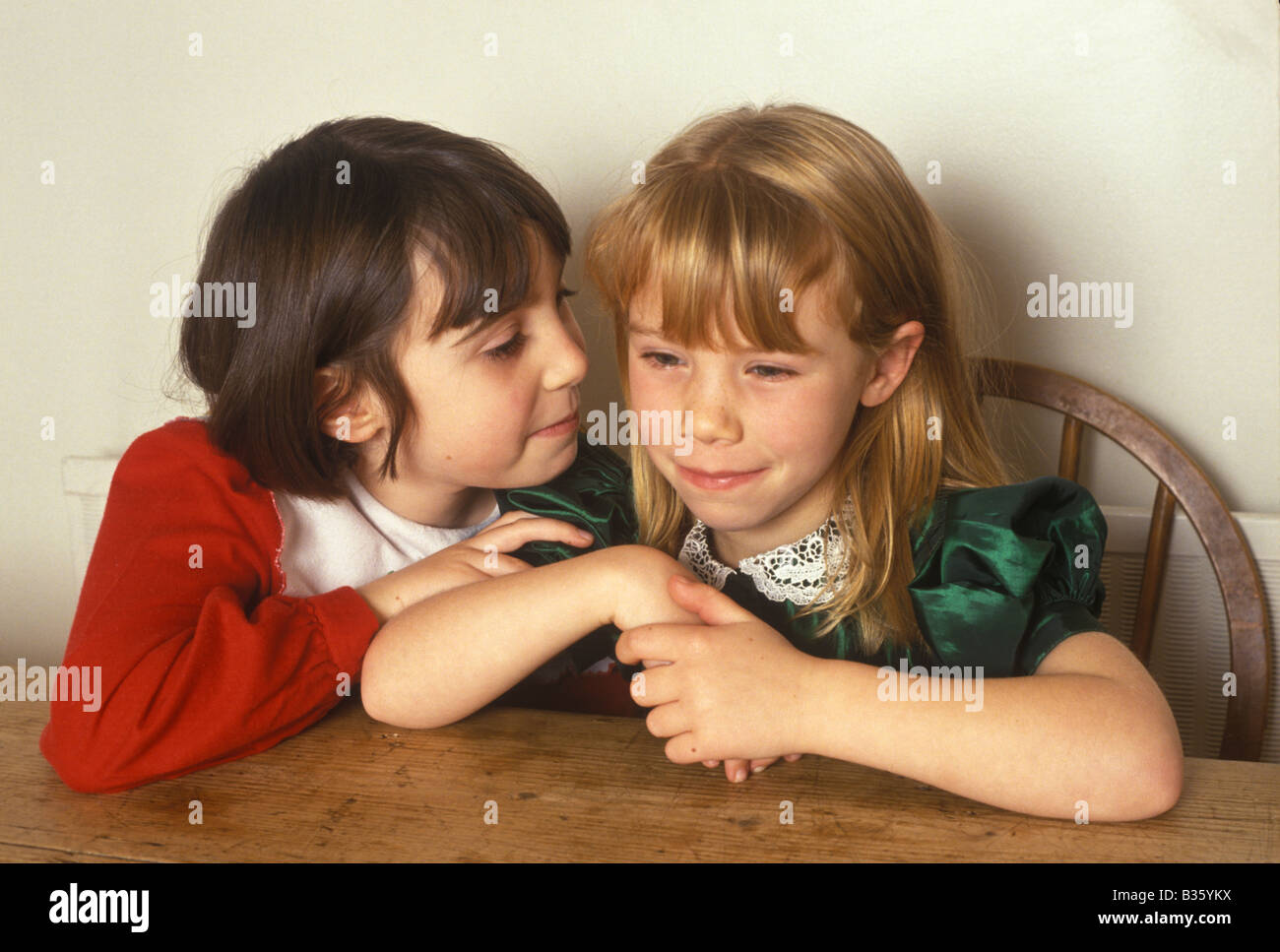 children whispering to each other Stock Photo - Alamy