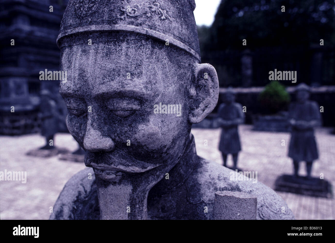 Close up detail of a carved stone Mandarin statue face with stone ...