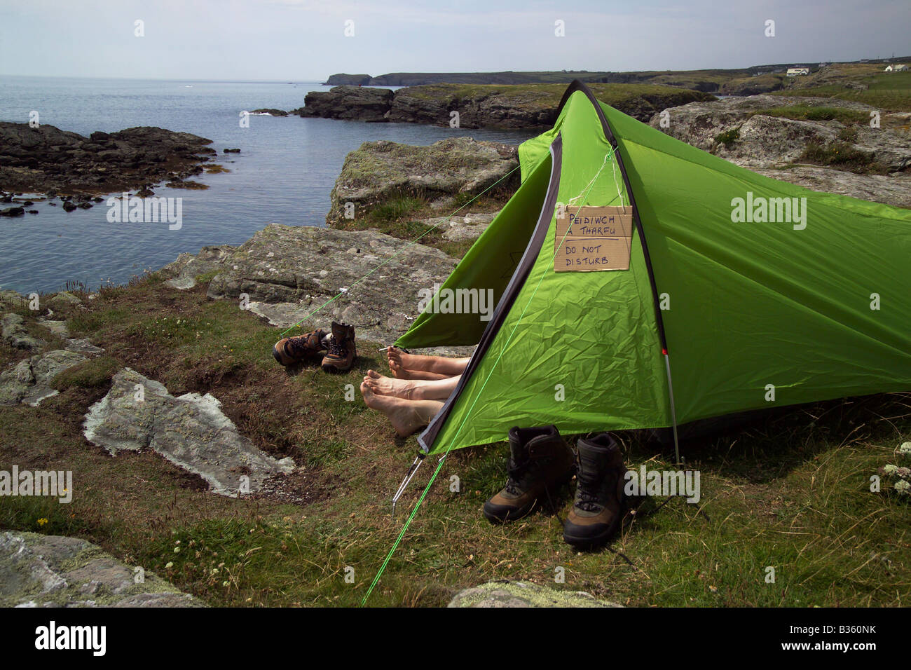 Green tent on cliff top overlooking the Sea Stock Photo - Alamy
