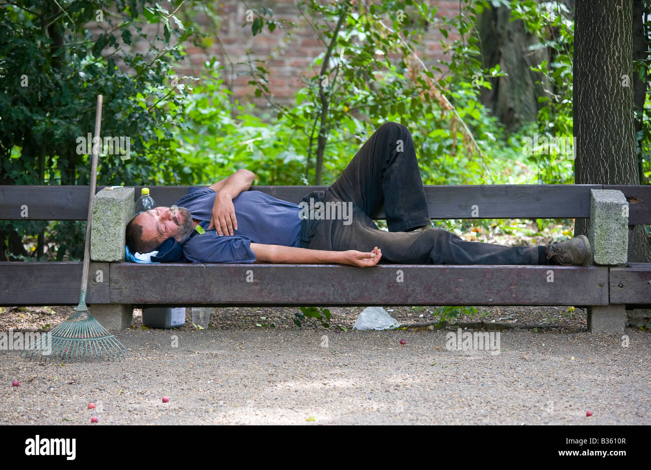 park keeper lying on bench Stock Photo - Alamy
