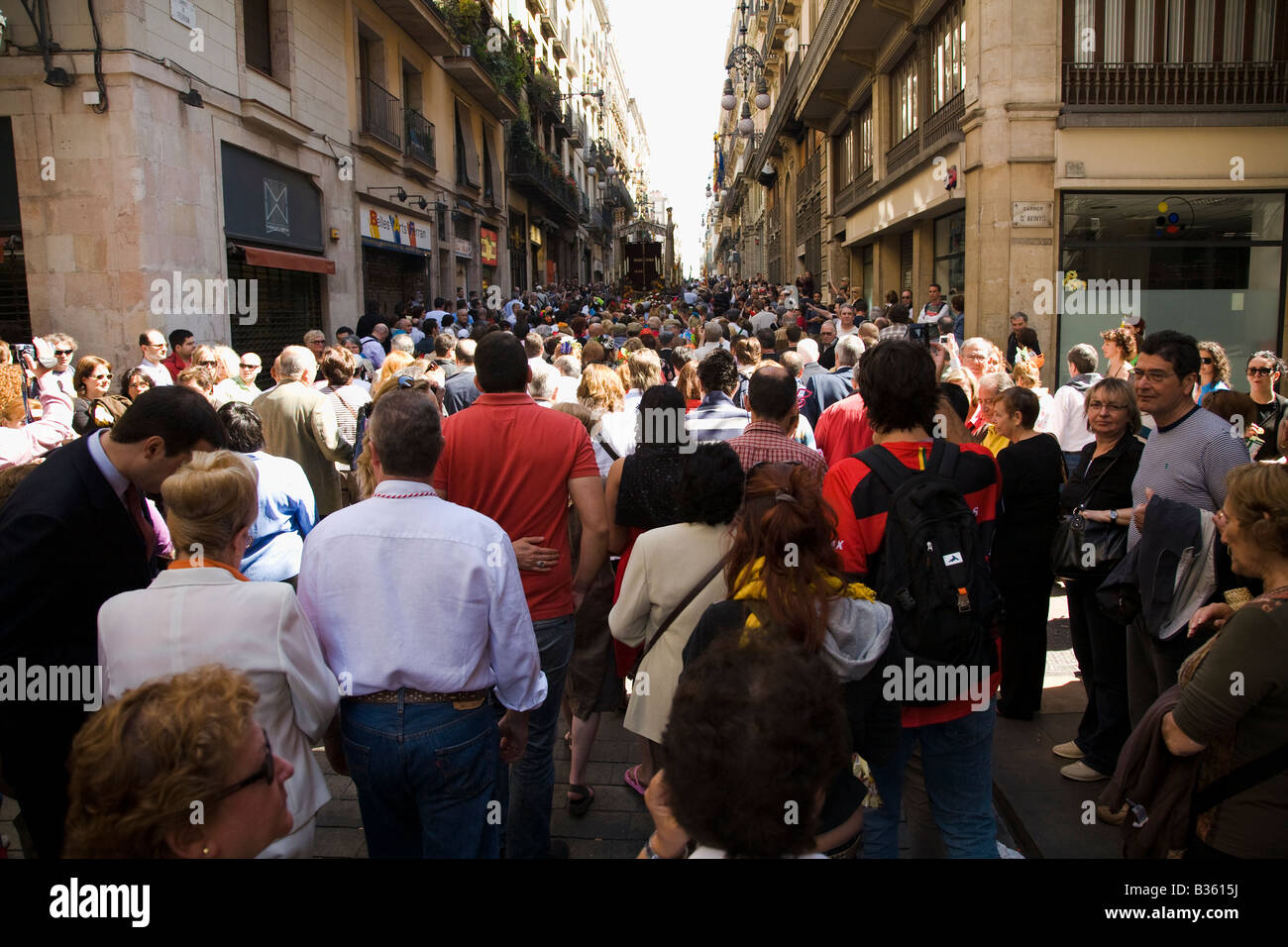 SPAIN Barcelona Crowd follow cart down street Day of Ascension ...