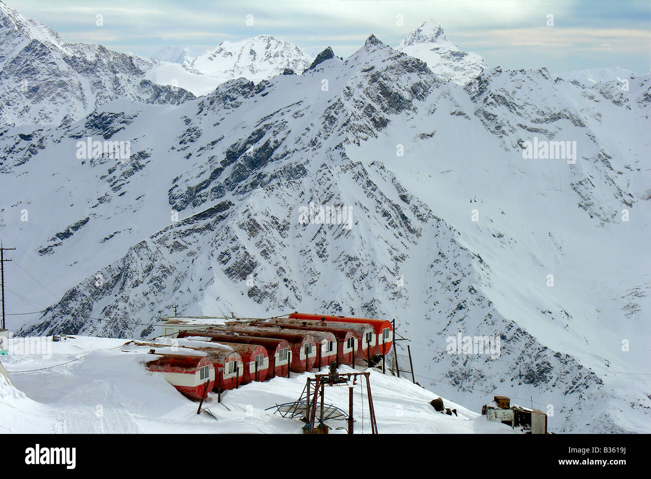 Base of climbers in snow covered mountains Stock Photo - Alamy