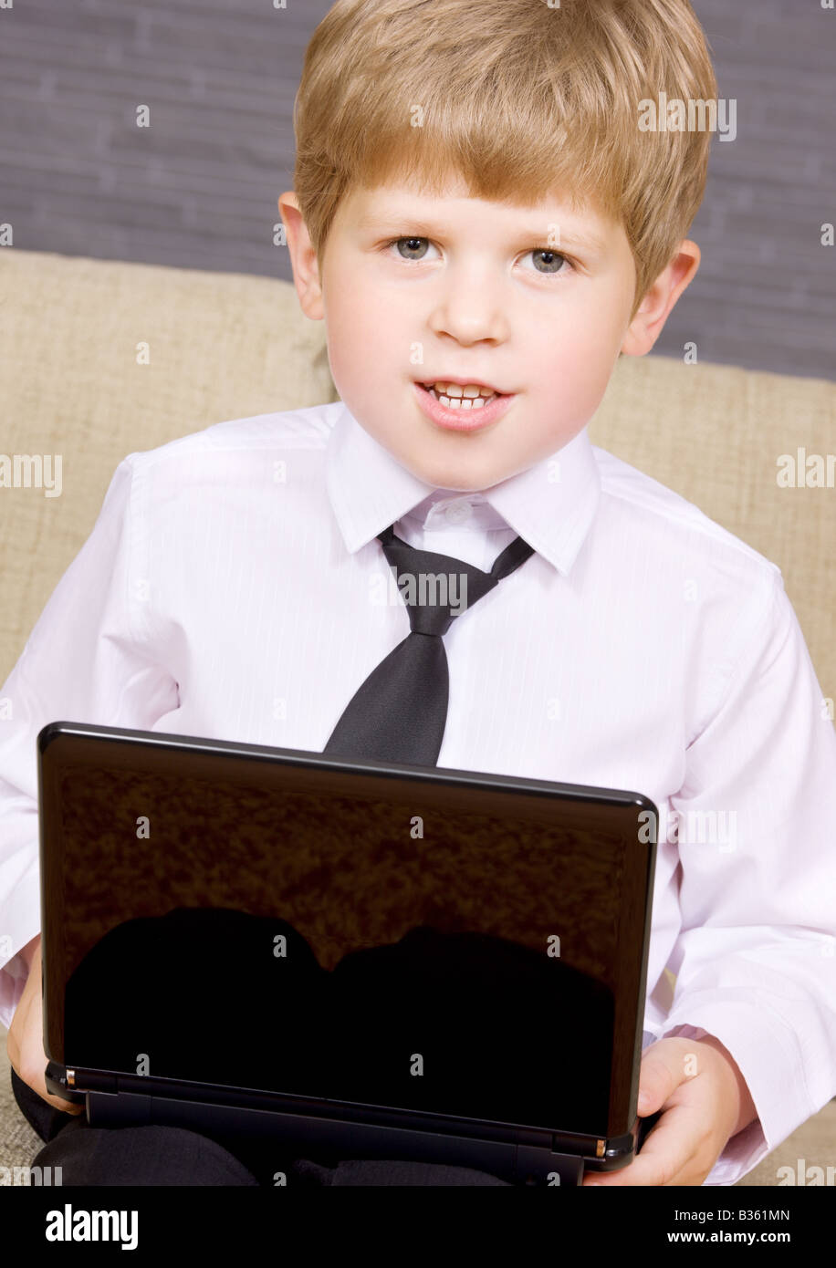 picture of happy boy with black laptop computer Stock Photo - Alamy