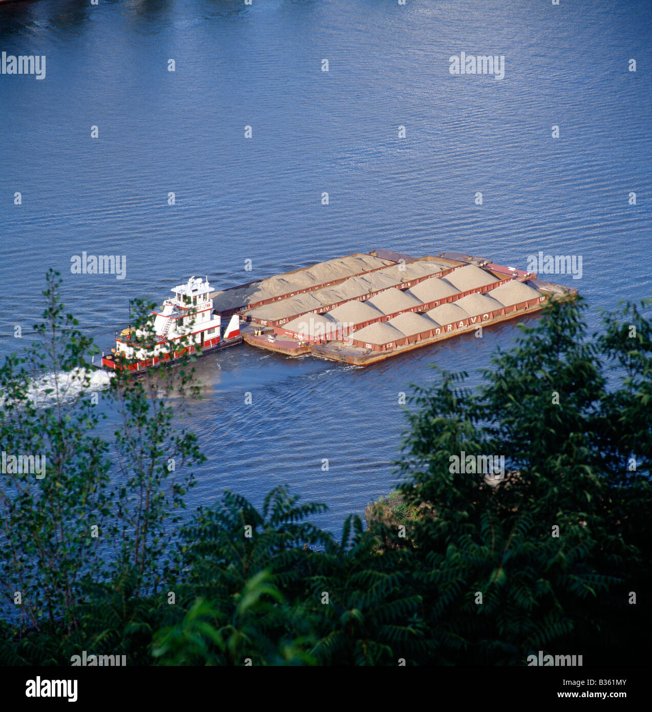 Tugboat pushing barges of natural materials (ore) up the Allegheny ...