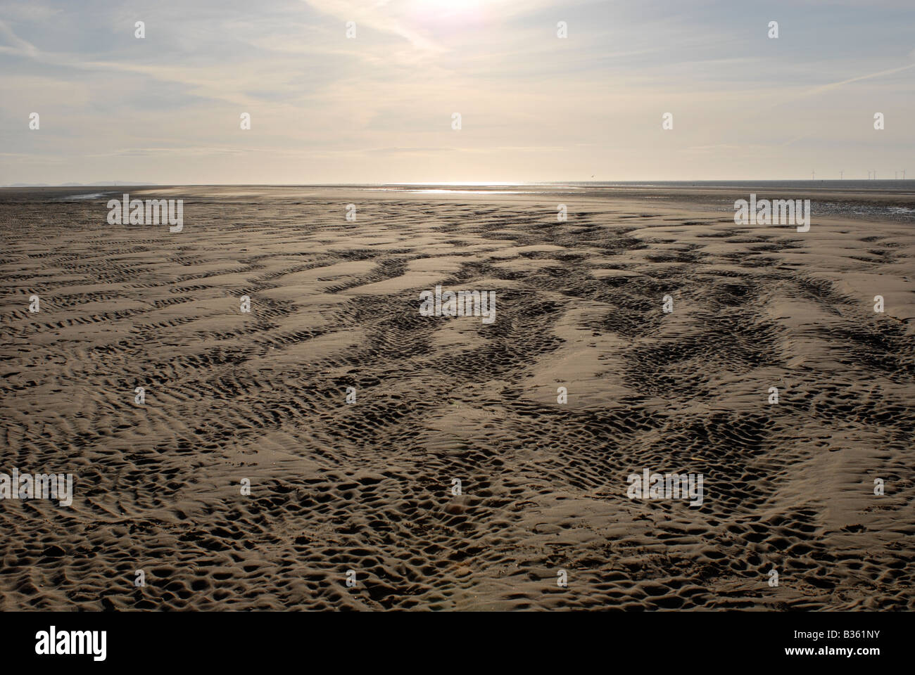 Rippling sand patterns photographed at sunset on Talacre beach in North ...