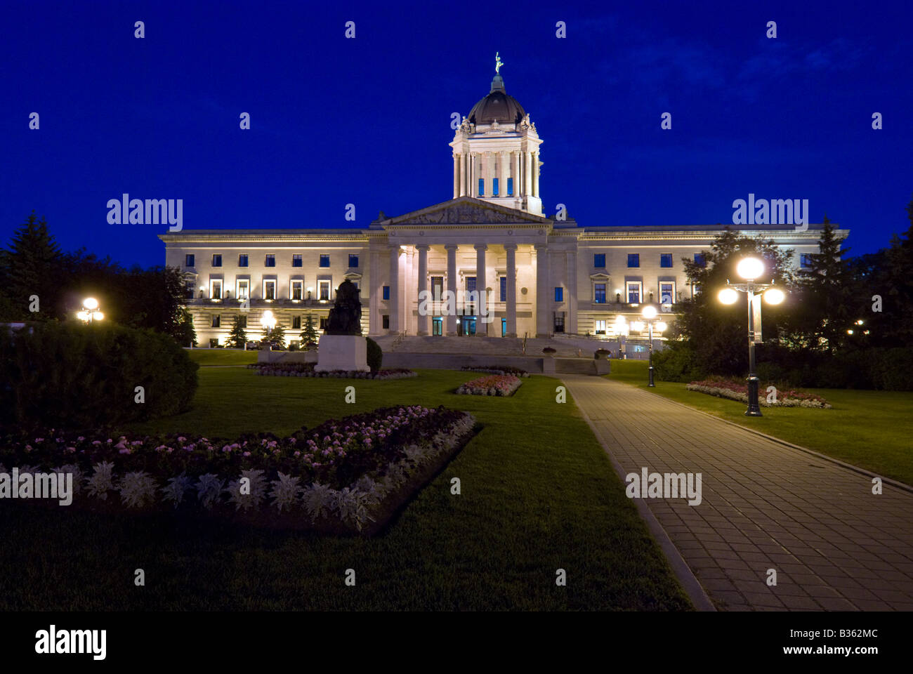 The Manitoba Legislative buildings illuminated at dusk in Winnipeg ...