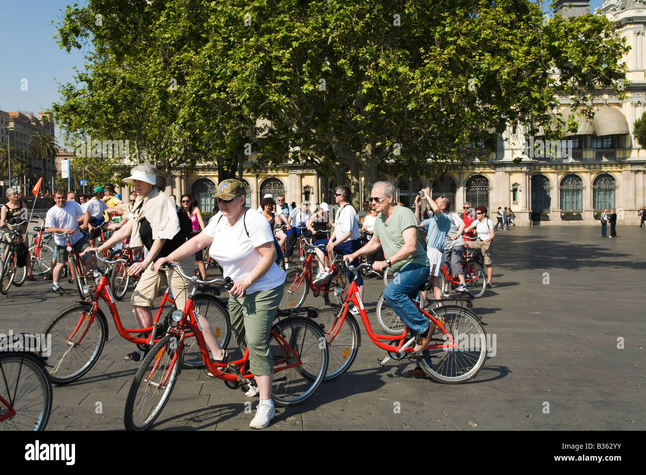 SPAIN Barcelona Bicycle tour group start from plaza near waterfront ...