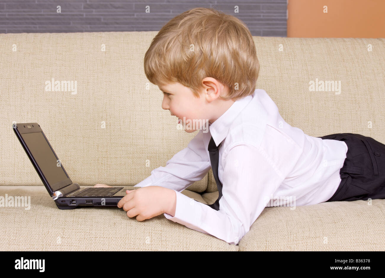 picture of happy boy with black laptop computer Stock Photo - Alamy