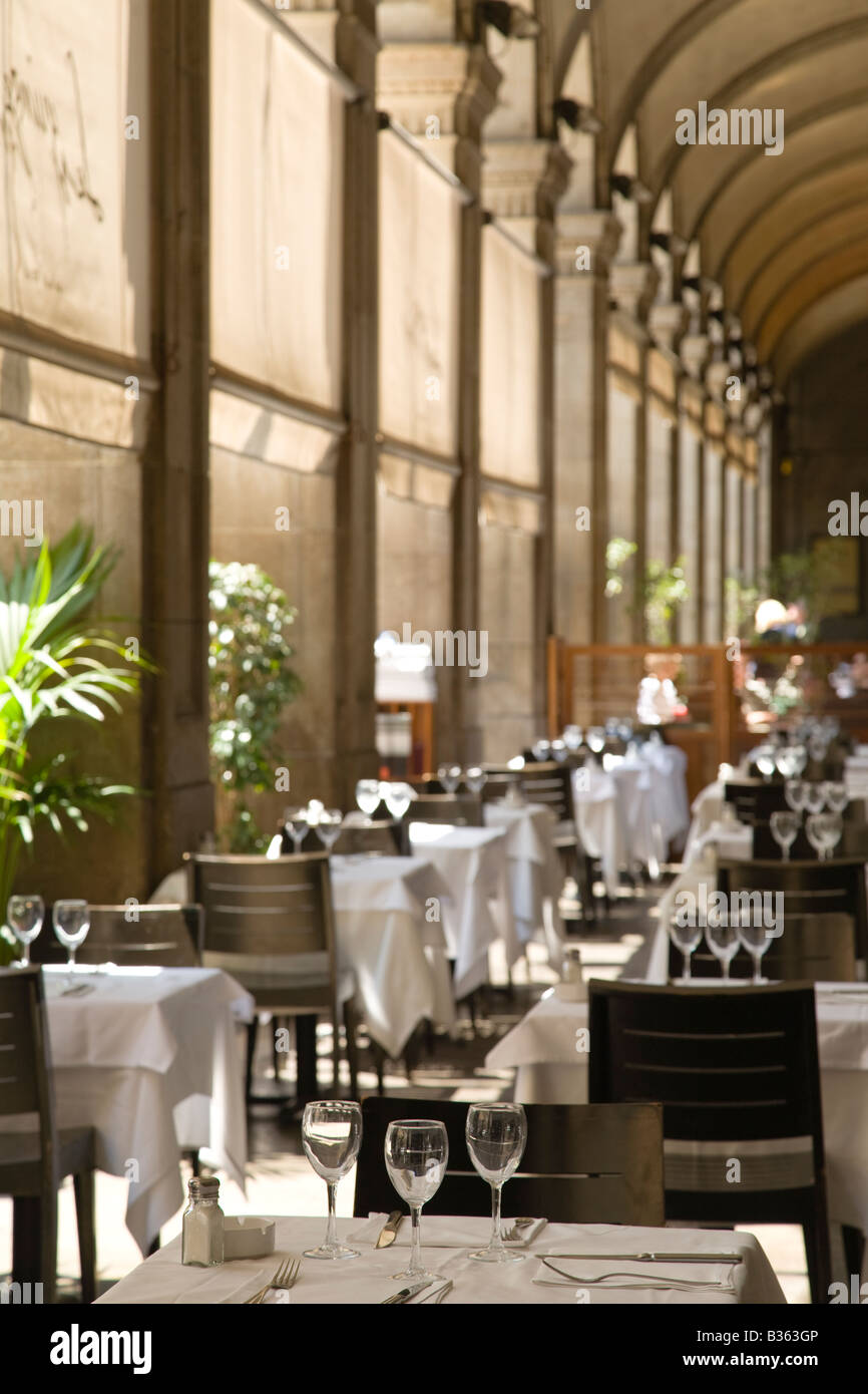 SPAIN Barcelona Empty restaurant tables set in walkway of Placa Reial ...