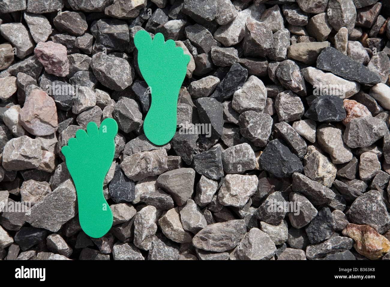 green foam foot prints as carbon footprint Stock Photo - Alamy