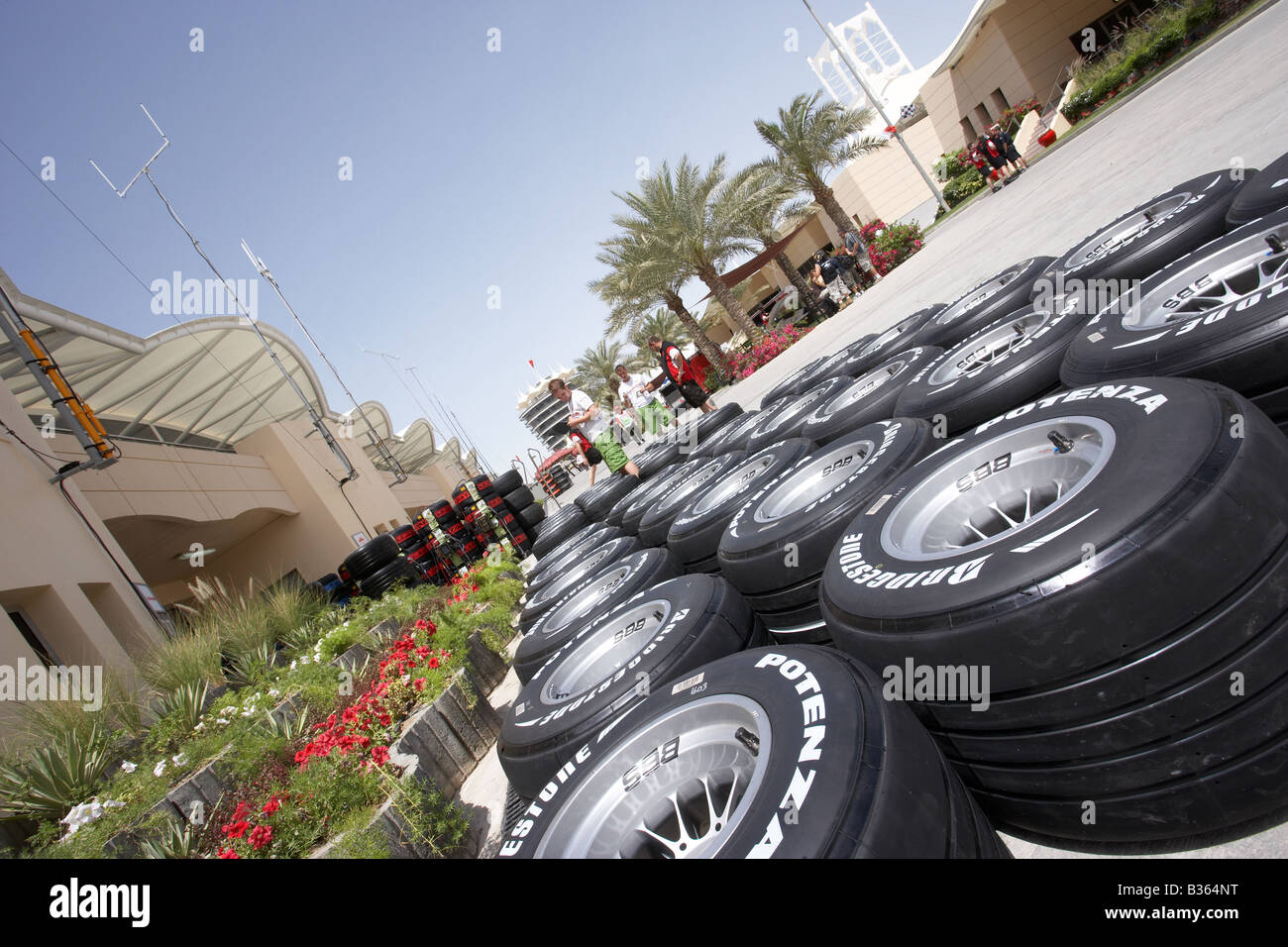 Honda team engineer checking tyres tires and wheels in the paddock at ...