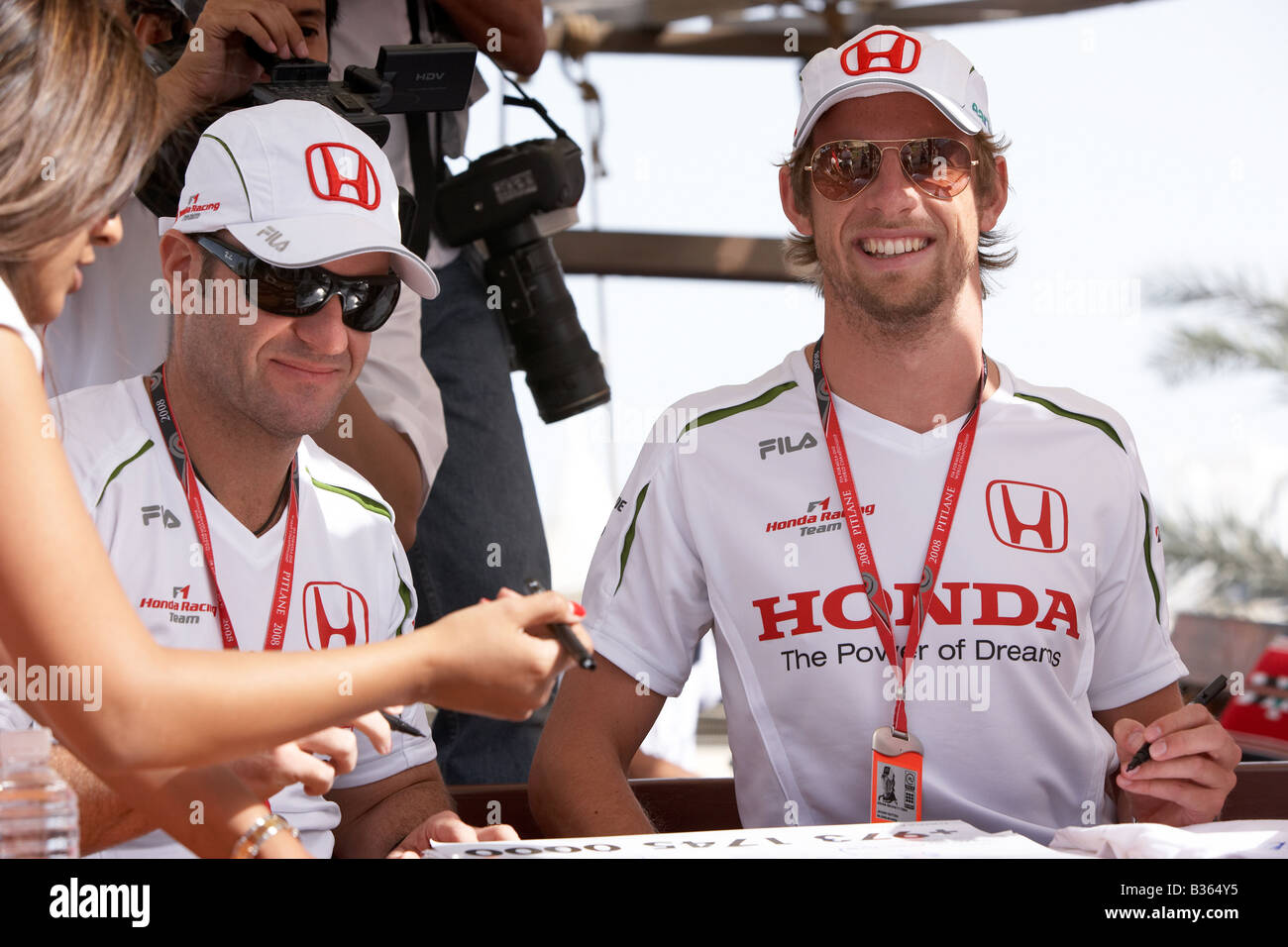 Jenson Button and Rubens Barrichello for Honda sign autographs for fans ...