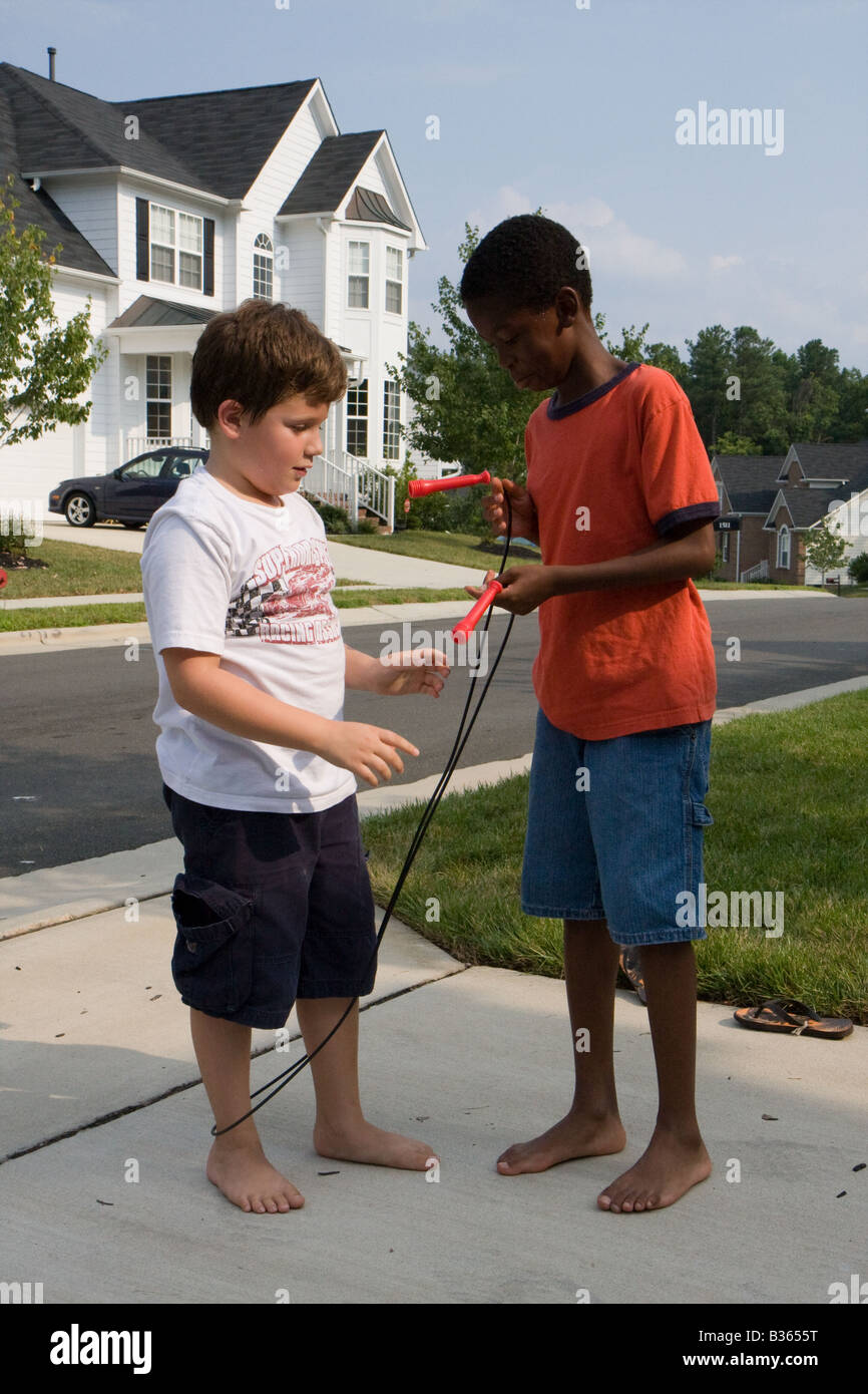 Black kids jumping rope hi-res stock photography and images - Alamy