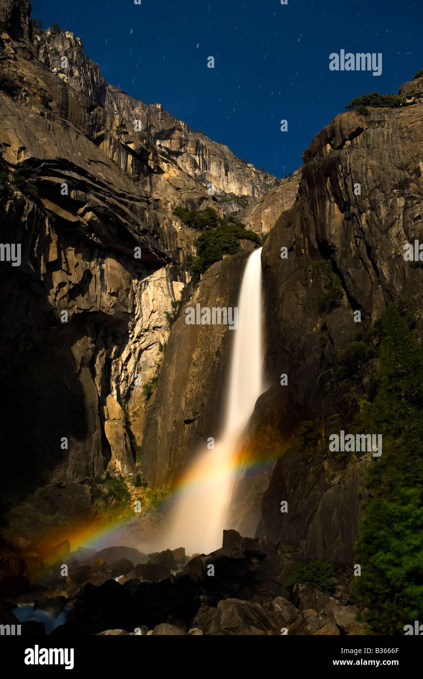 A lunar rainbow moonbow forms over the base of lower Yosemite Falls ...