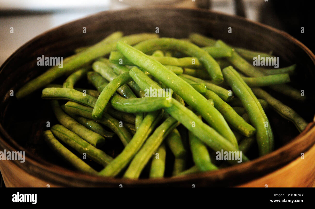 green beans steaming in bamboo steamer Stock Photo - Alamy