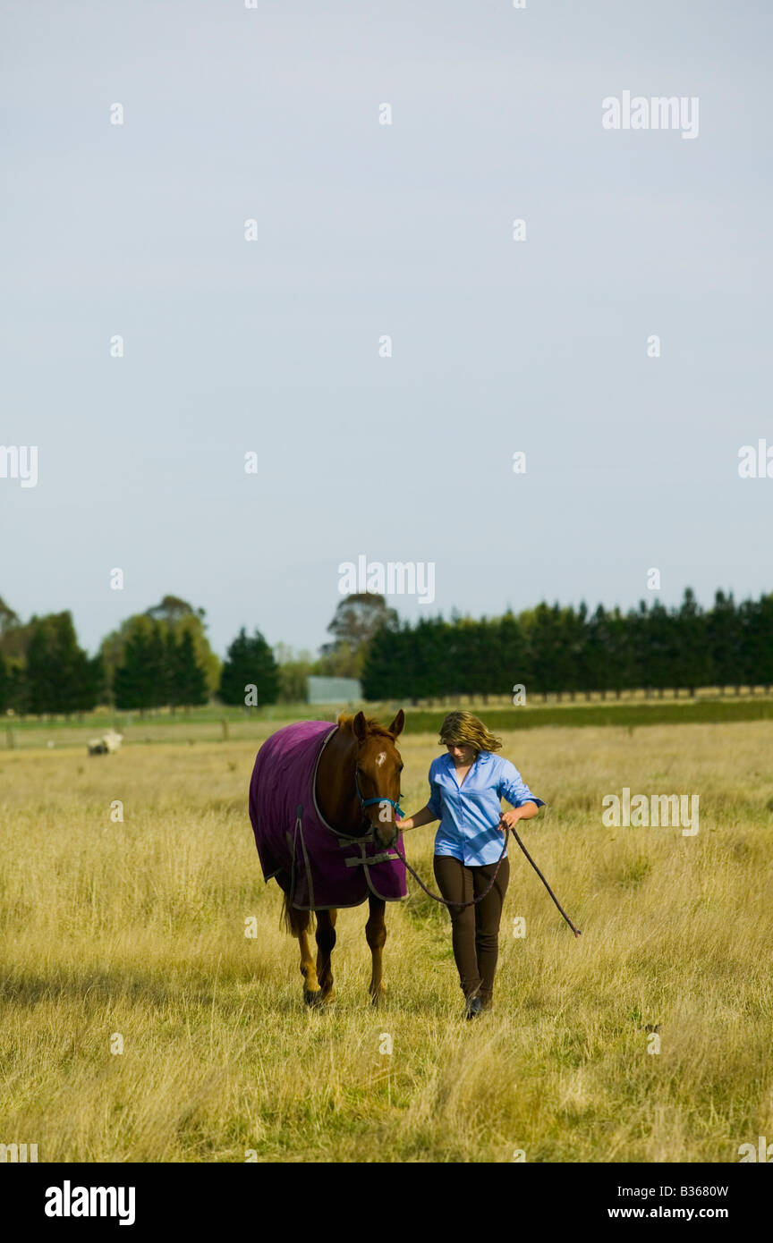 Girl leading horse hi-res stock photography and images - Alamy
