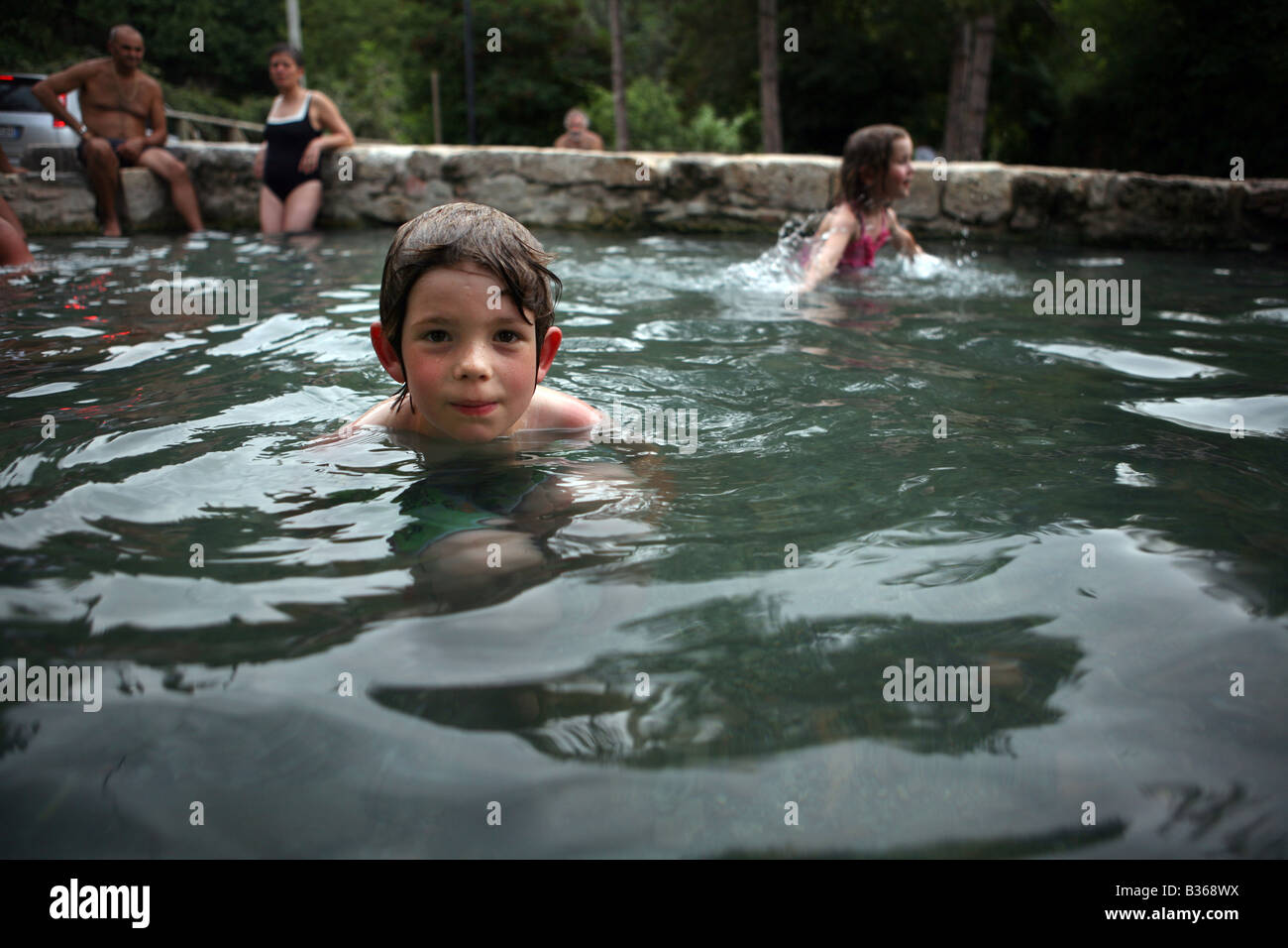 Pic Shows a young boy enjoying a thermal spring in Tuscanny Stock Photo ...