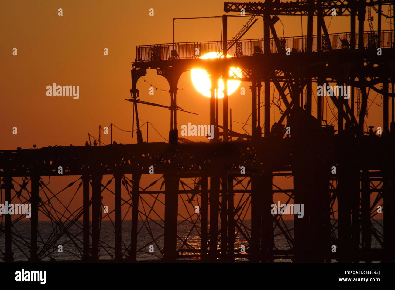 Sunset over West pier in Brighton, England Stock Photo - Alamy