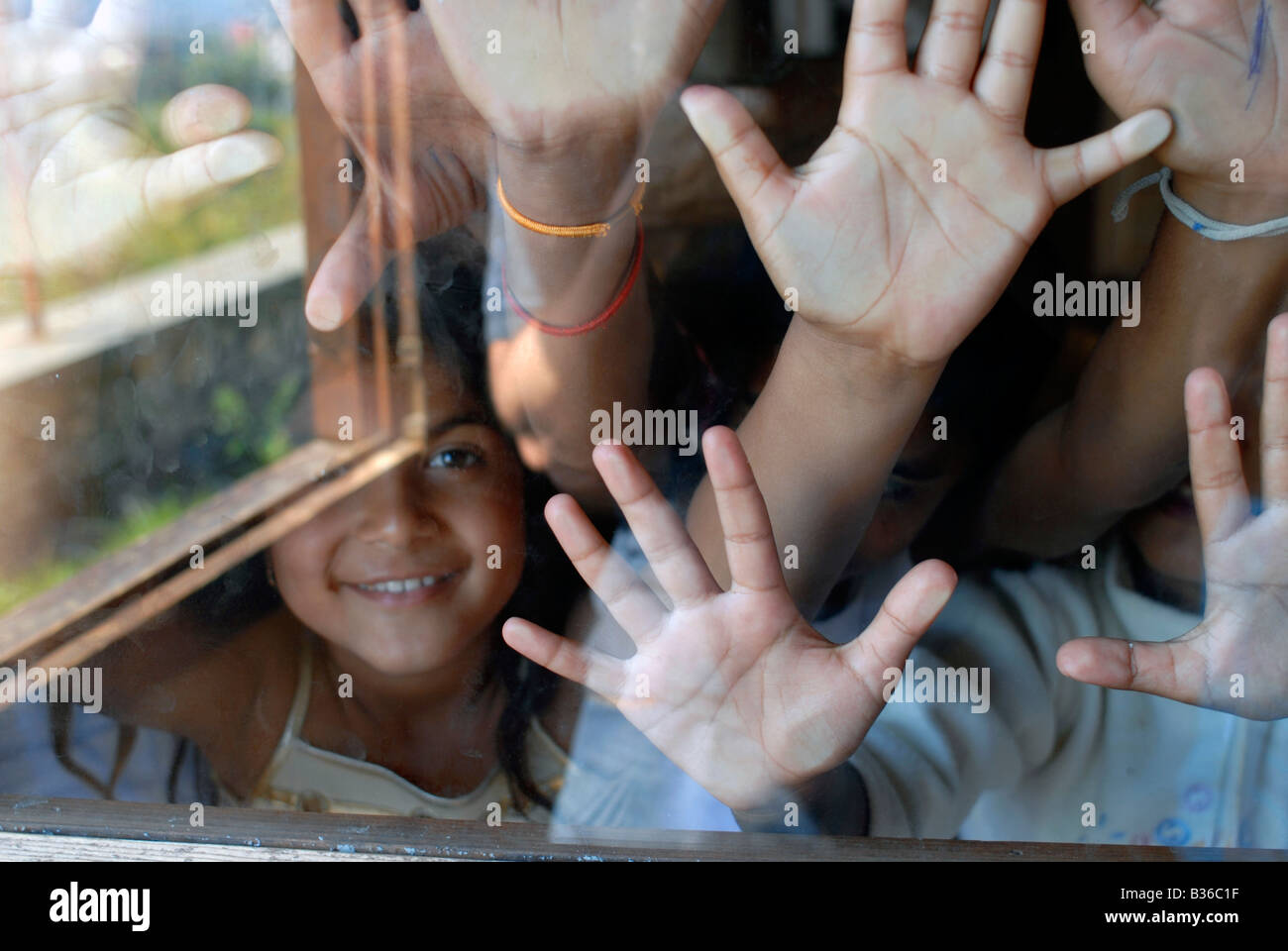 Children hands pressed against a window in a school Stock Photo - Alamy