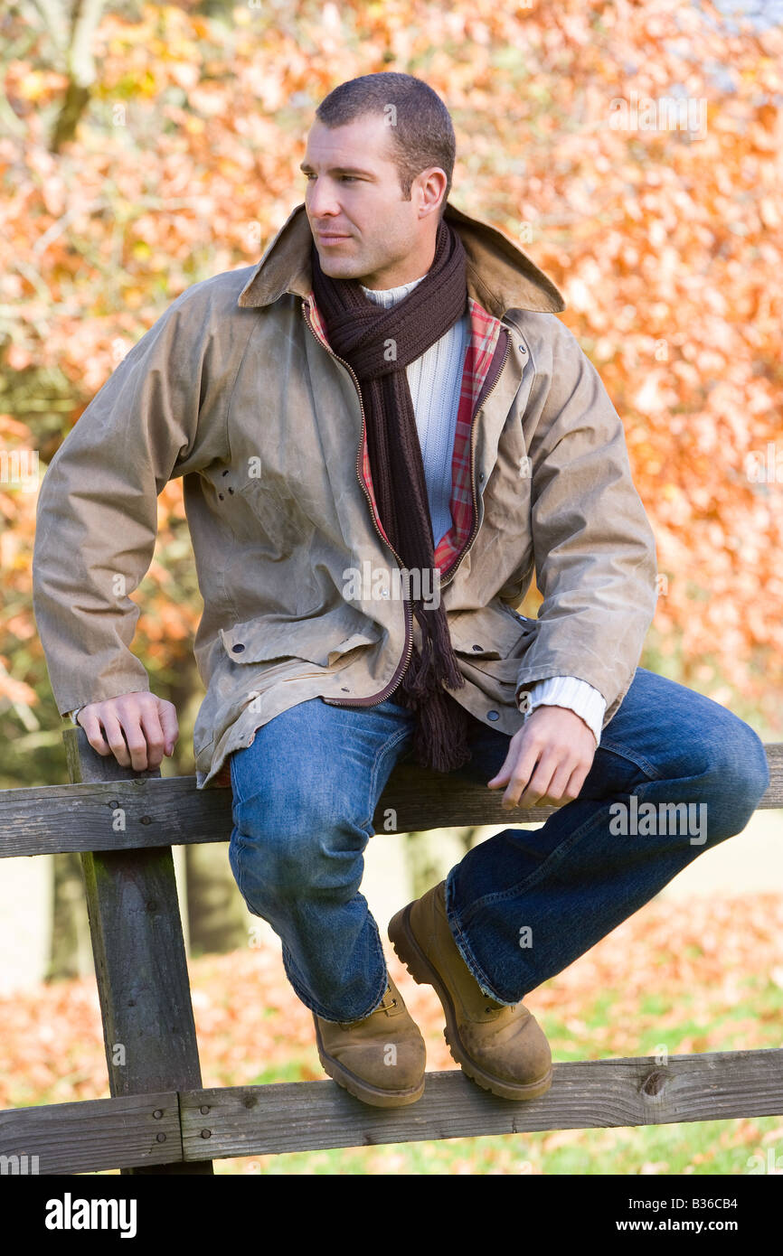 Man sitting on fence hi-res stock photography and images - Alamy