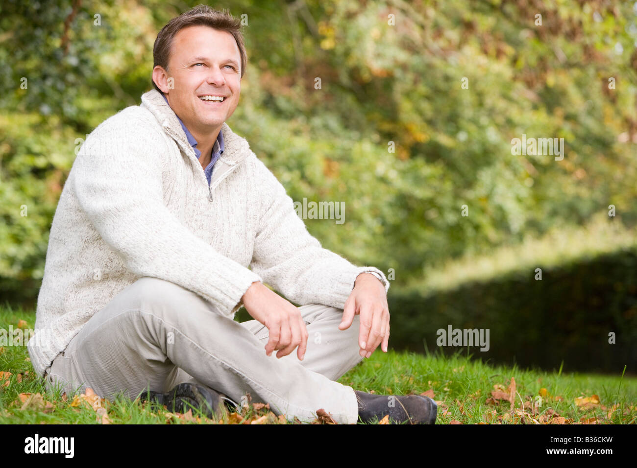 Smiling at man sitting hi-res stock photography and images - Alamy