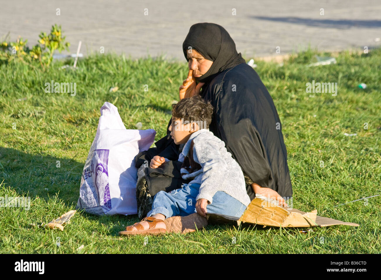 Homeless Mother and Son in a Park in Damascas Syria Stock Photo - Alamy