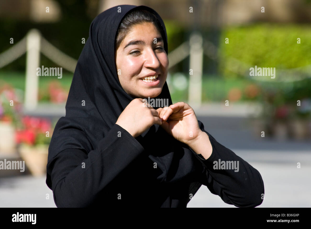 Teenage Iranian Girl Adjusting her Headscarf at the Tomb of Hafez in ...