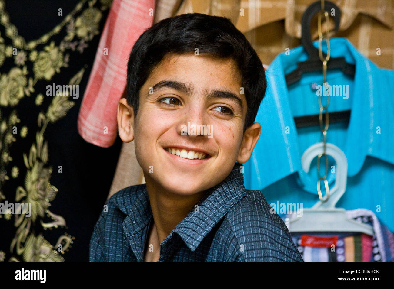 Iranian Boy Selling Clothing in Regents Bazaar in Kerman Iran Stock ...