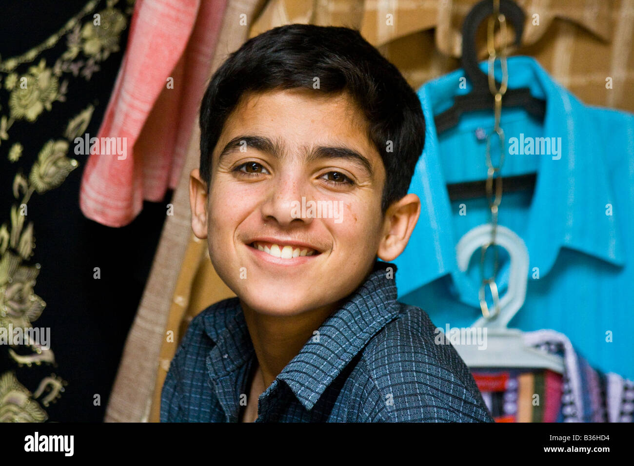 Iranian Boy Selling Clothing in Regents Bazaar in Kerman Iran Stock ...