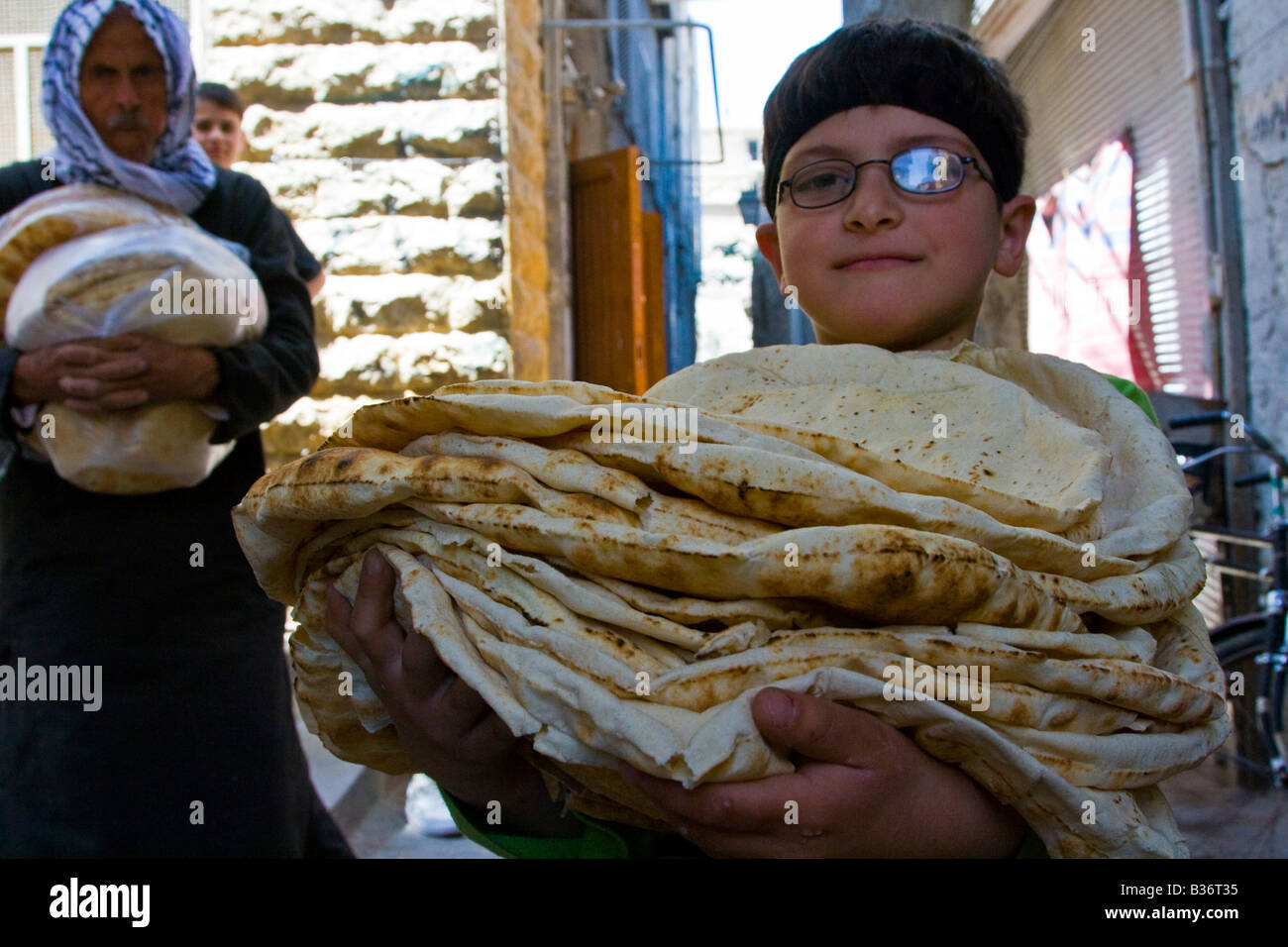 Boy Carrying Fresh Bread from a Shop in the Old City in Aleppo Syria ...